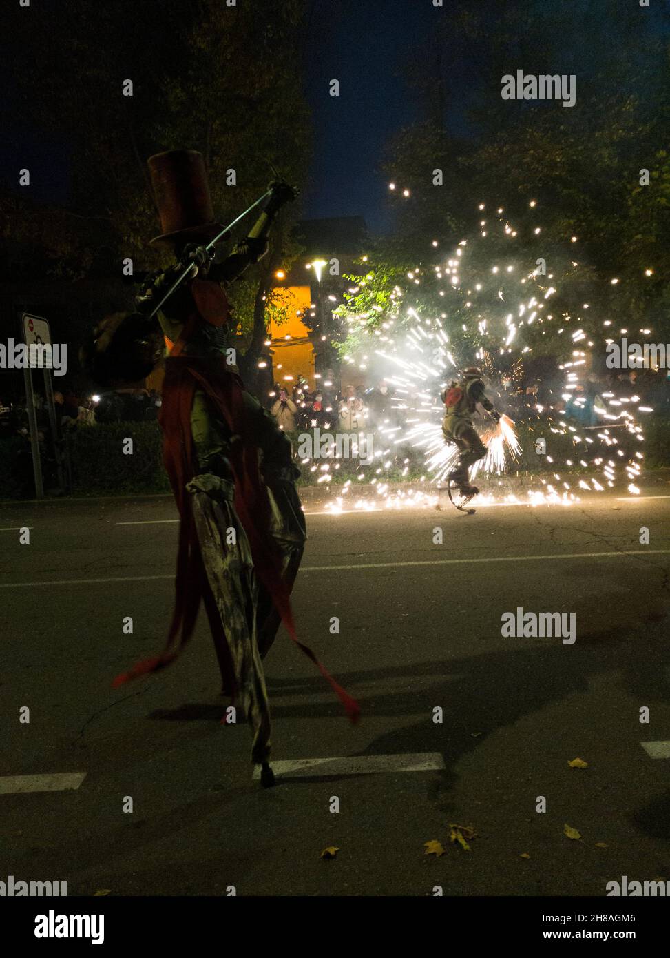 Magical autumn parade Hervas fireworks man with stilts Stock Photo - Alamy