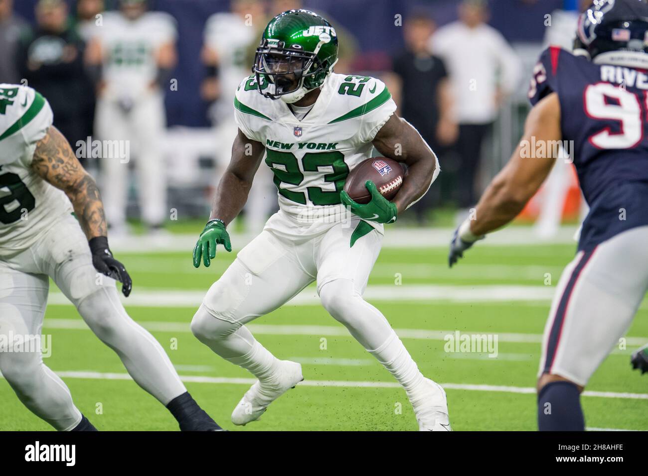 Houston, TX, USA. 28th Nov, 2021. New York Jets running back Tevin Coleman (23) carries the ball ...