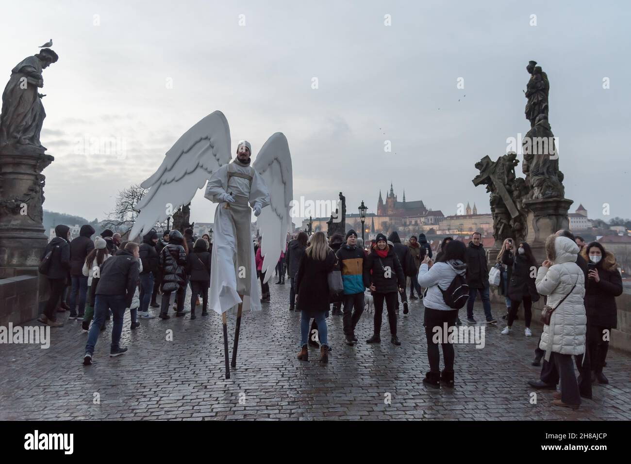 Prague, Czech Republic. 28th Nov, 2021. An artist wearing angelic wings ...