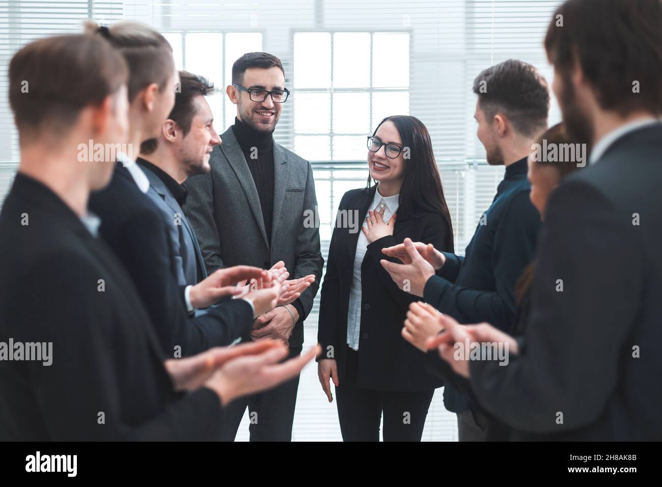 close up. business team congratulating their colleagues with applause ...