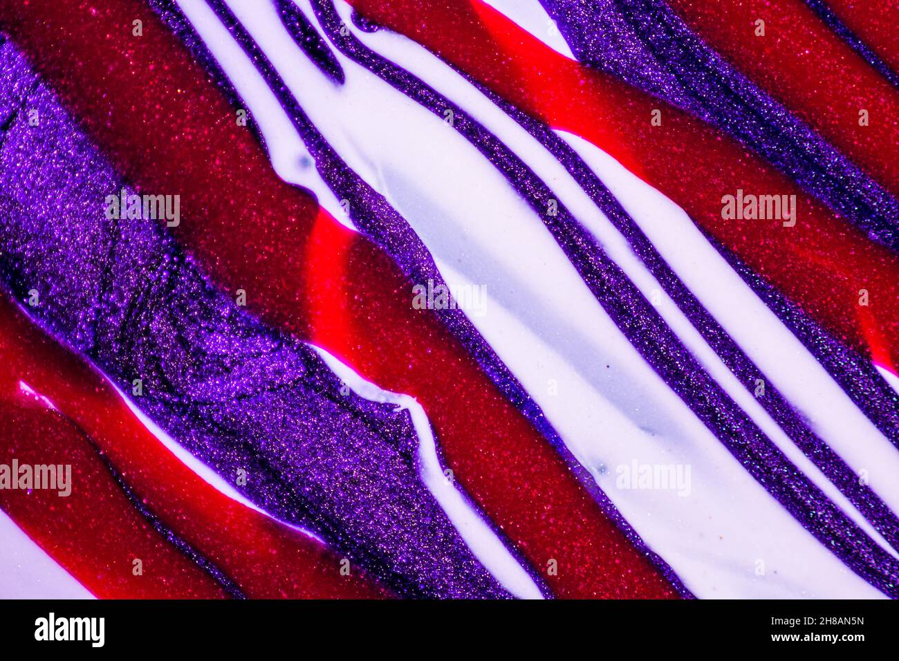 Abstract red and violet-colored backdrop with waves on a water surface ...
