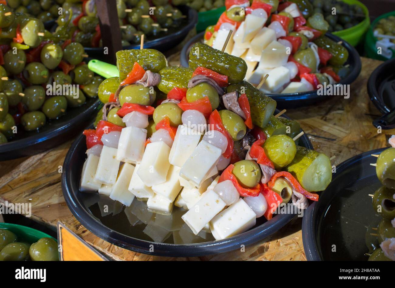 Skewered appetizers or spanish banderillas. Delicious brochettes filled ...