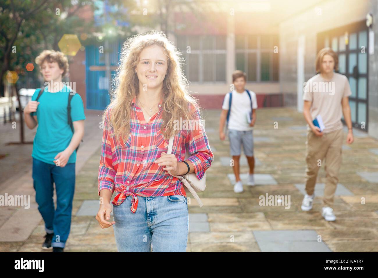 Teenager girl going home after school Stock Photo - Alamy