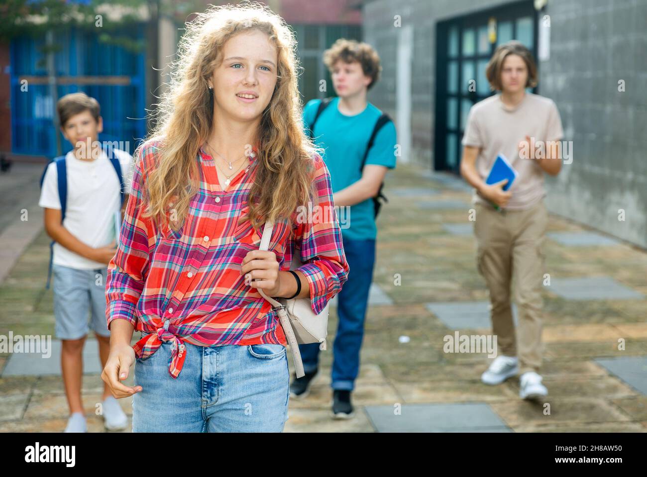 Teenager girl going home after school Stock Photo - Alamy