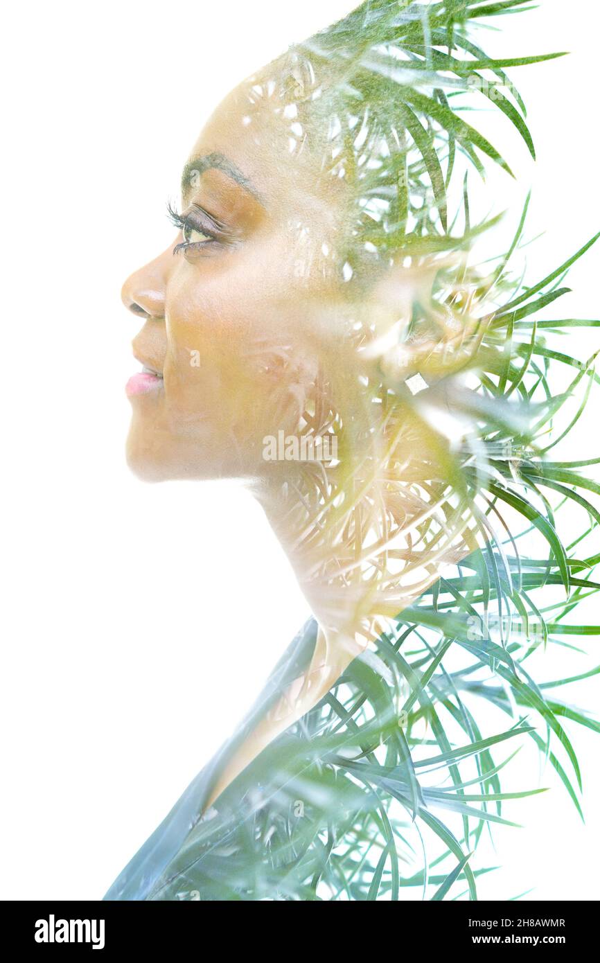 A portrait of a woman combined with foliage in a double exposure ...