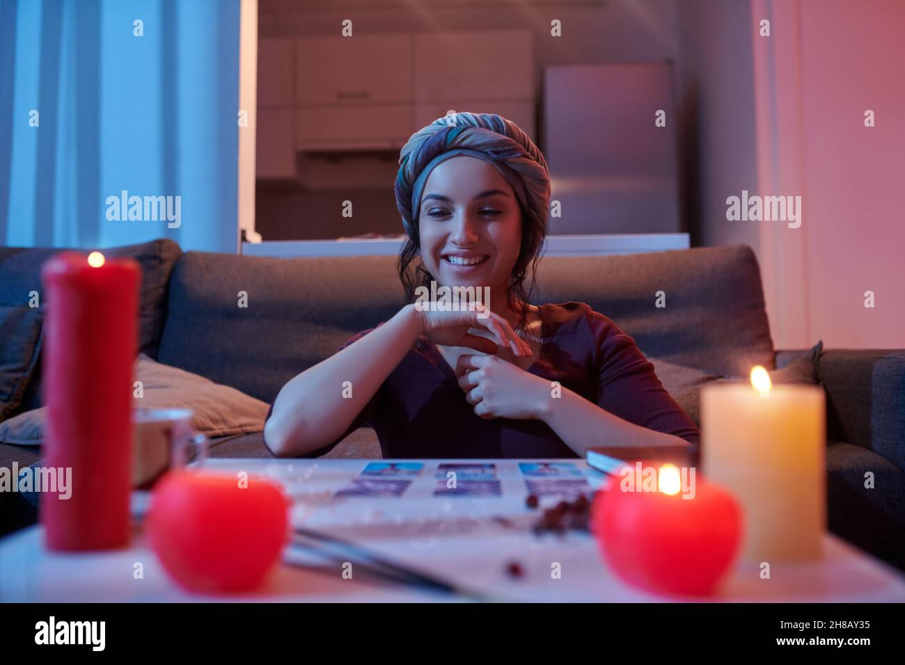Joyous young fortune-teller preparing for a divination session Stock ...