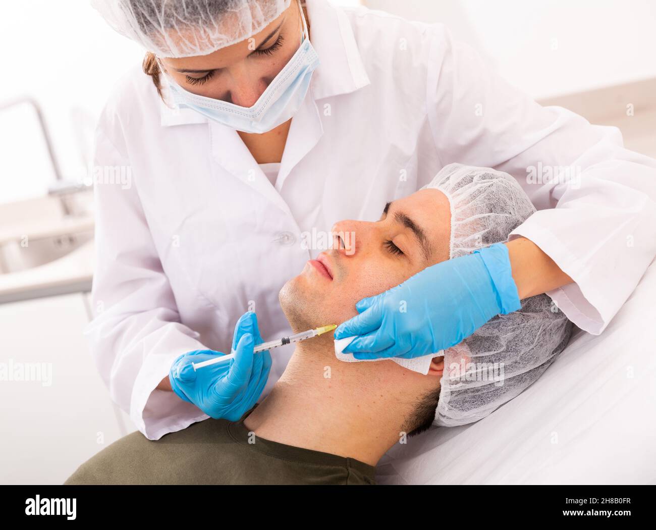 Male patient getting face injections Stock Photo - Alamy