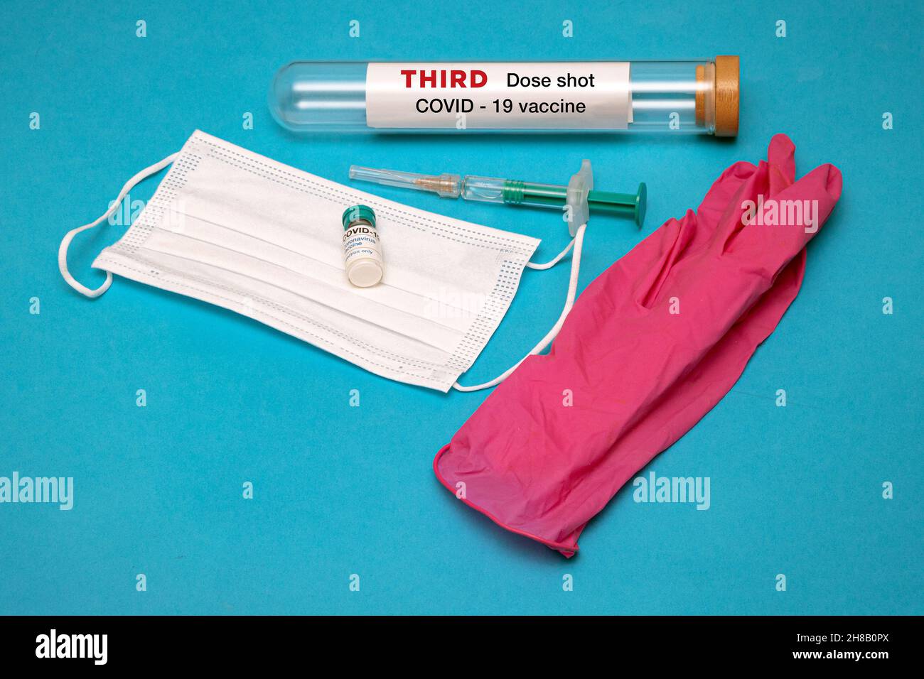 Third dose of Covid-19 vaccine as a booster shot in syringe ready to be ...