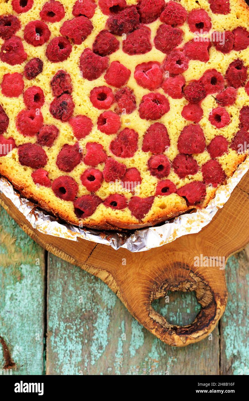 Homemade pie with organic raspberries topview vertical Stock Photo - Alamy