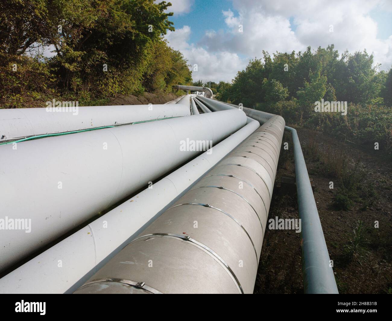 Pipeline system in rural landscape Stock Photo - Alamy