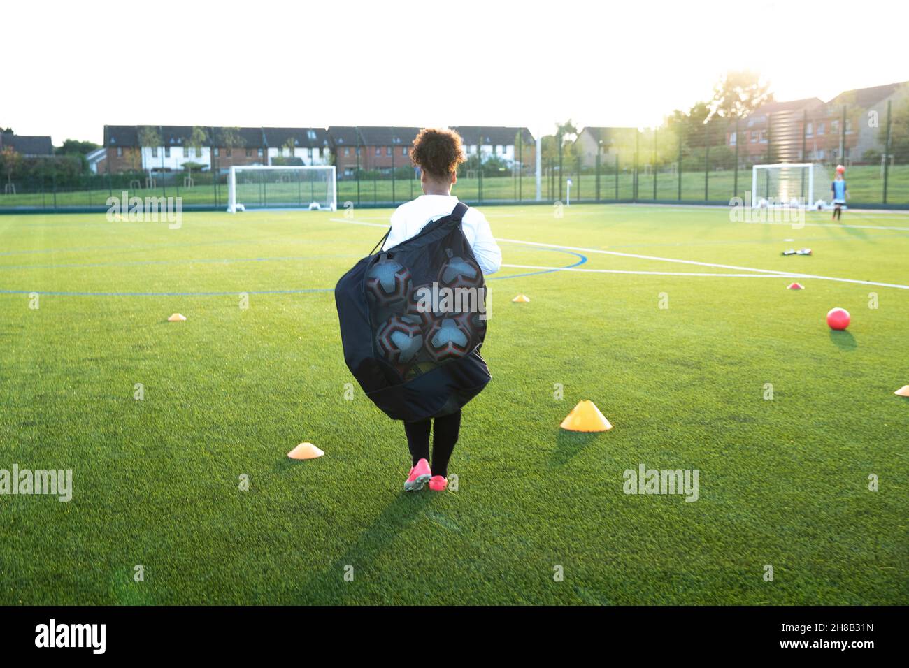 Soccer training child carrying ball hi-res stock photography and images ...