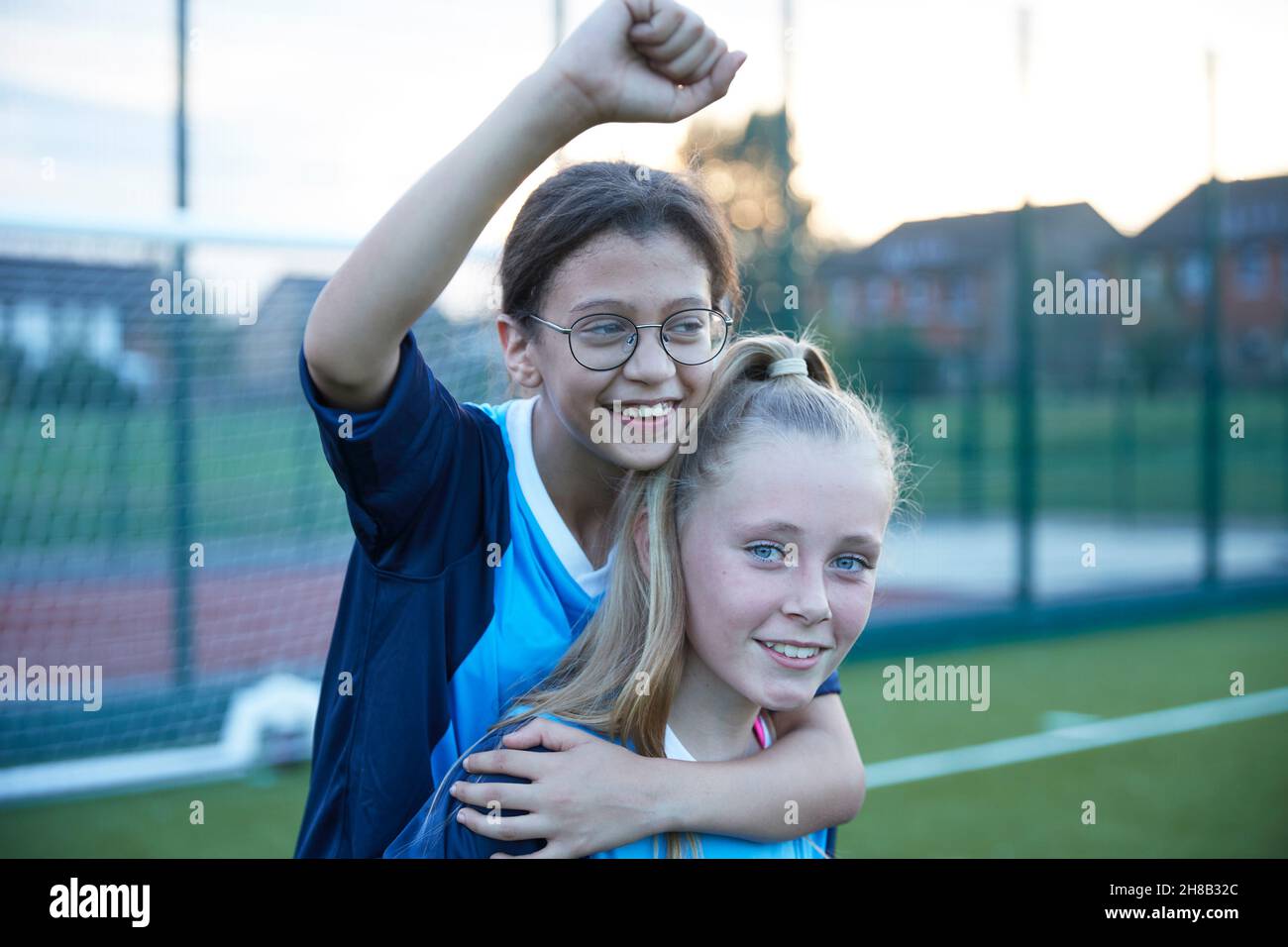 UK, Smiling female soccer players in field Stock Photo - Alamy