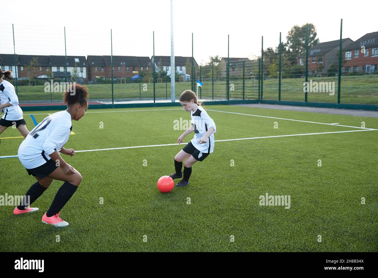 Girls playing soccer in field hi-res stock photography and images - Alamy