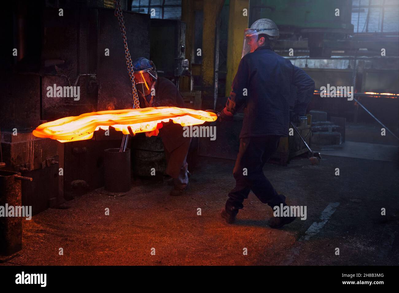 Flight bar (mining component) having been forged in a 15 MT counterblow hammer, is moved to ...