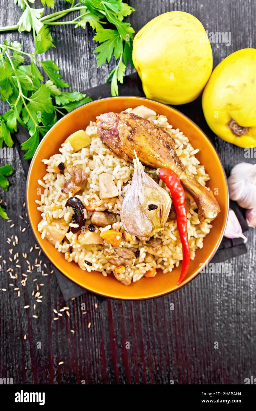 Pilaf of rice, duck, quince, carrots with garlic, onion, prunes and ...