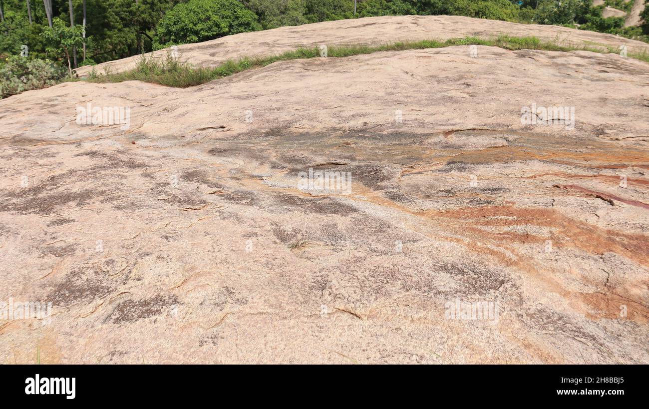 The beautiful rock fall is on the slope of natural trees Stock Photo ...