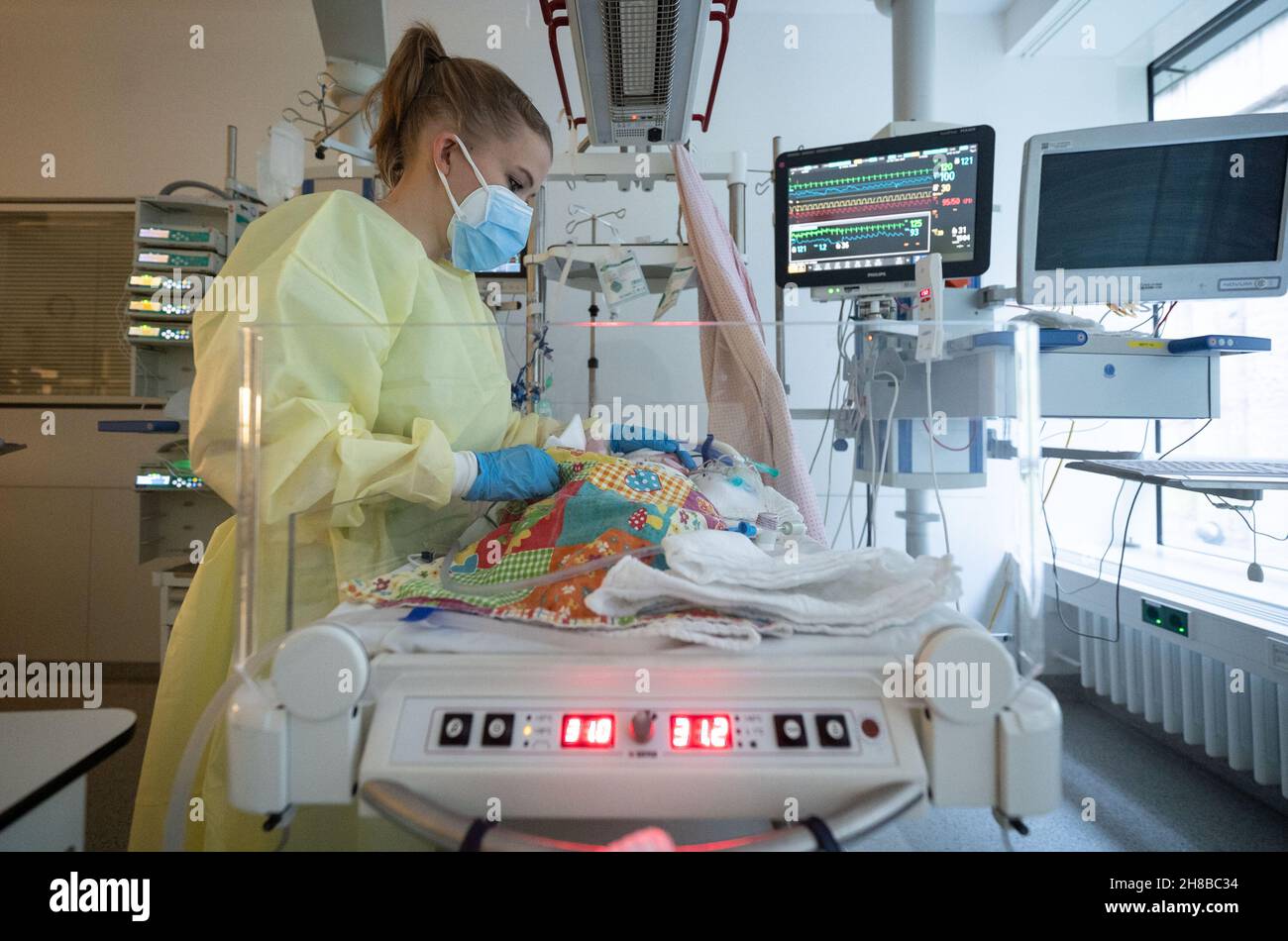 Stuttgart, Germany. 25th Nov, 2021. An intensive care nurse cares for a ...