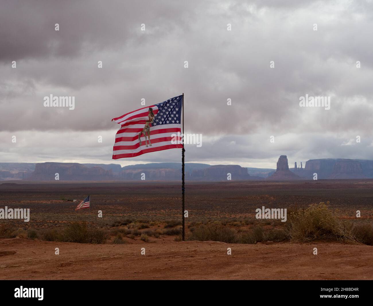 Two unfurled American flags with Native American on horseback stamped ...