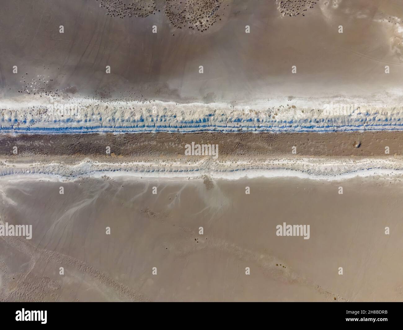 Aerial view of a dried-up riverbed as a result of global climate change ...
