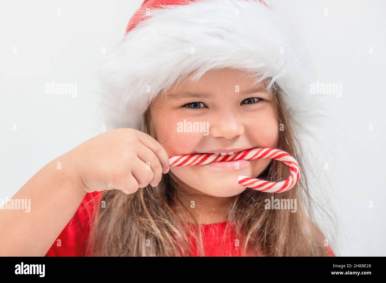 Child candy cane child smile hi-res stock photography and images - Alamy