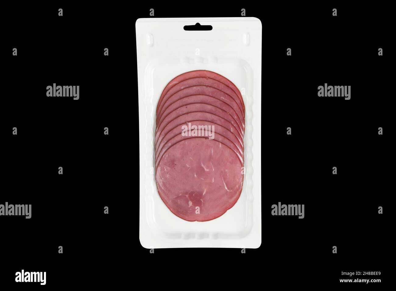 Front view of sliced smoked beef meat in vacuum package isolated on ...