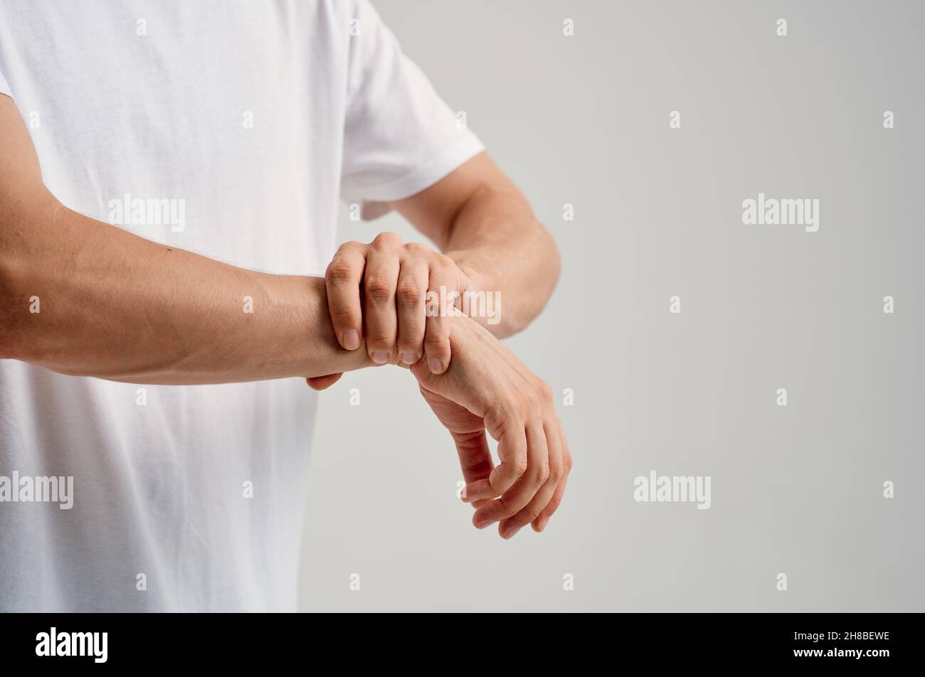 man holding hand injury pain health problem Stock Photo - Alamy
