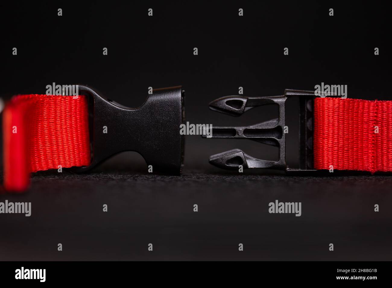 fastening with a carabiner on a red ribbon Stock Photo - Alamy