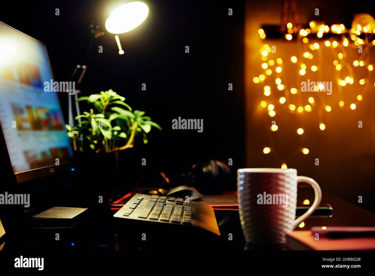 Overtime and remote work. Workplace with cup af coggee and computer ...