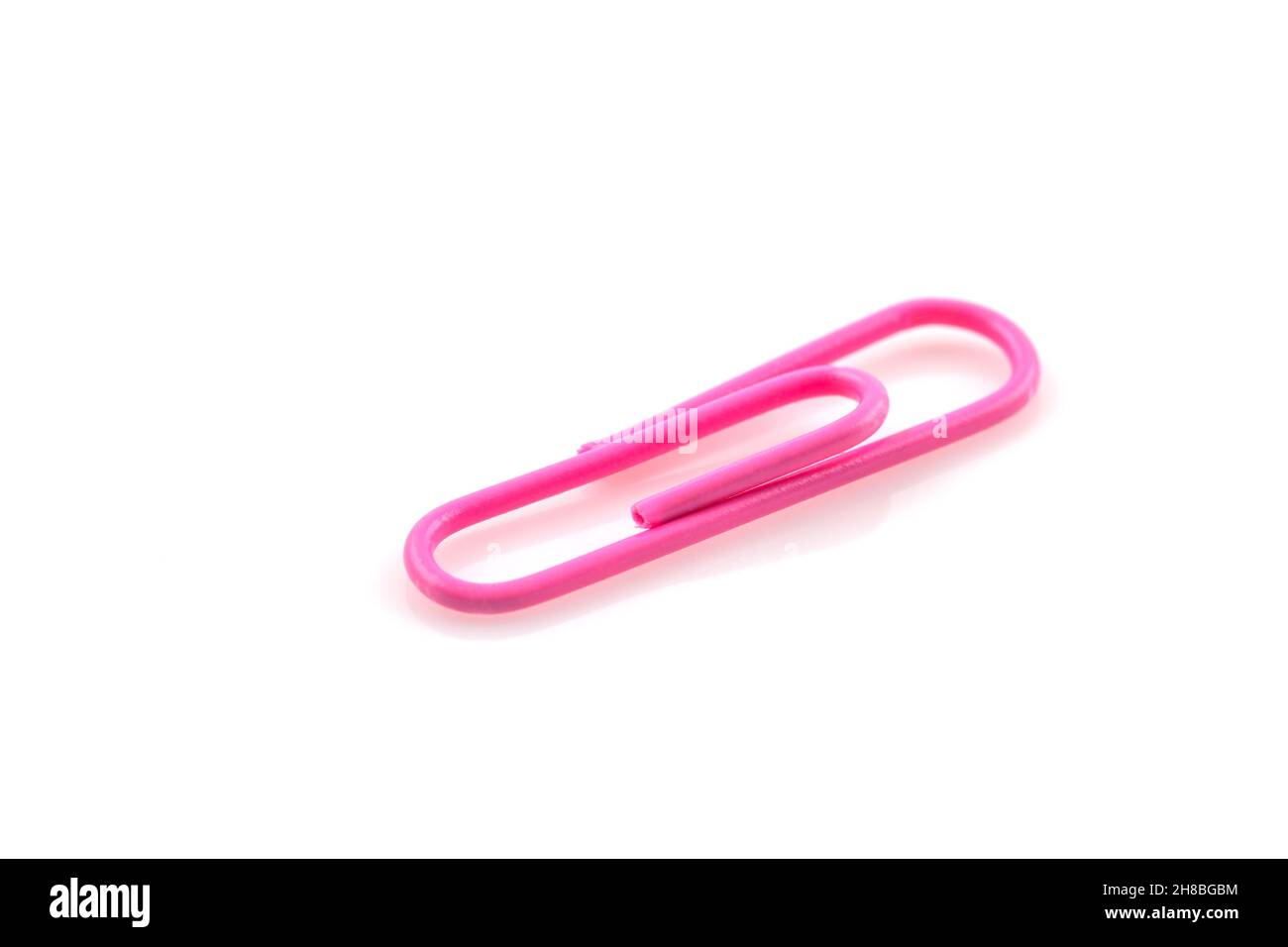 Single Pink paper clip isolated on white background Stock Photo - Alamy