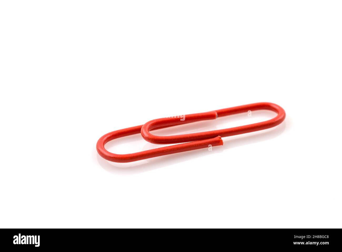 Single Red paper clip isolated on white background Stock Photo - Alamy