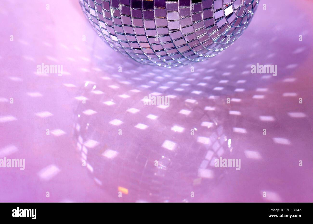 Violet mirror ball Stock Photo - Alamy