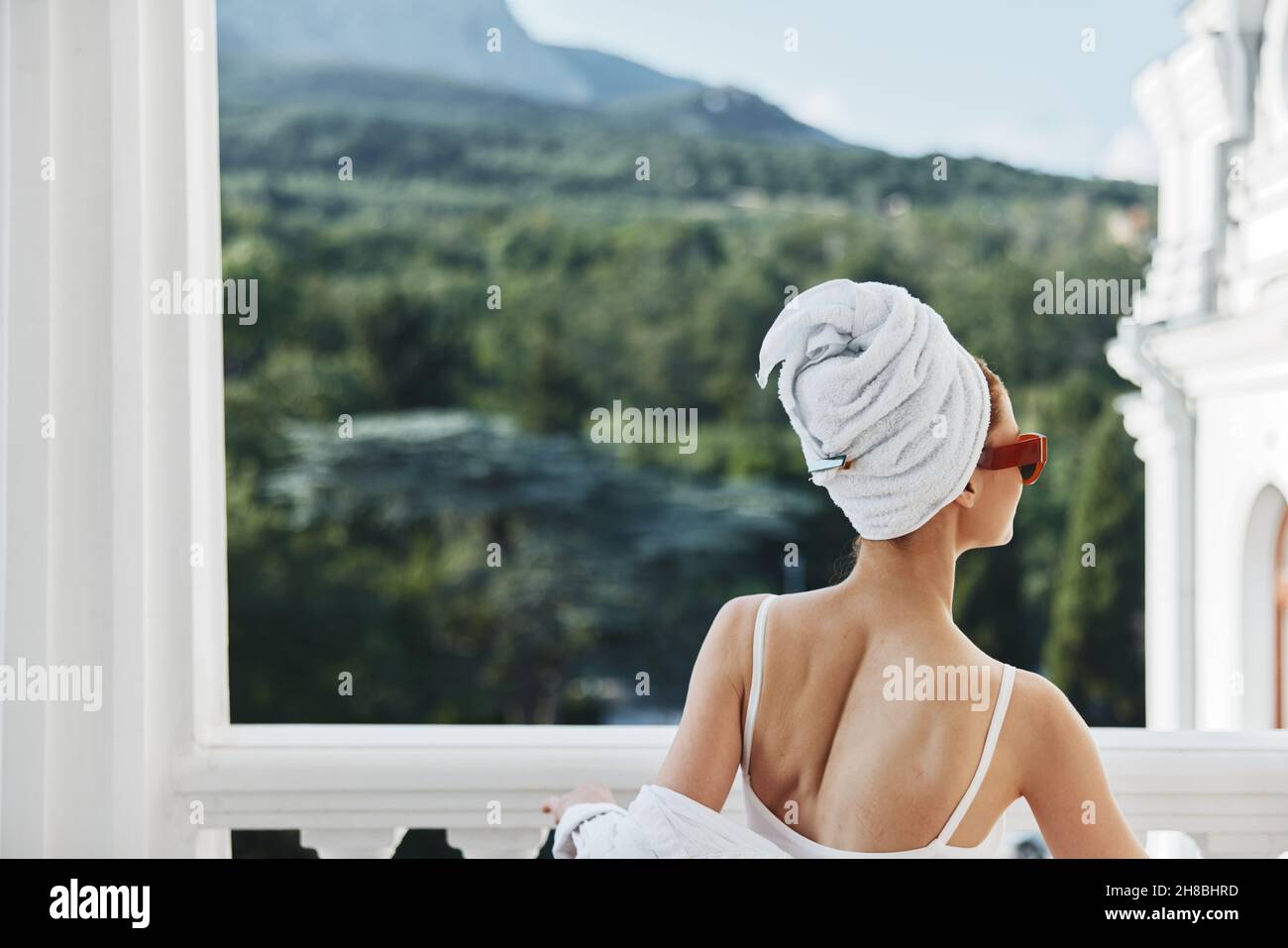 Portrait of gorgeous woman towel and sunglasses on balcony Perfect ...