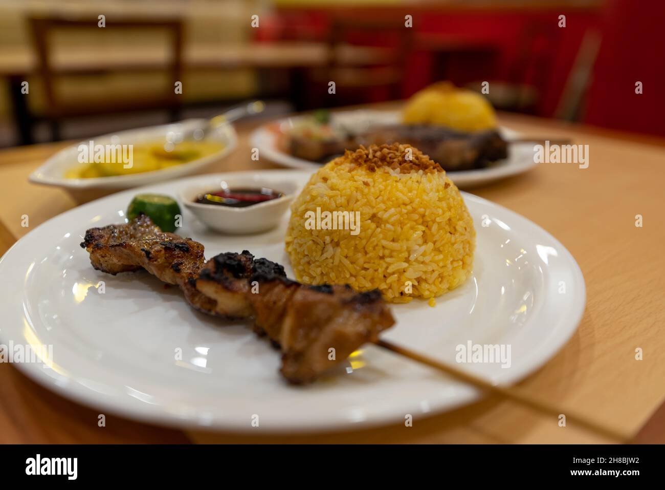 Popular Filipino food pork inasal with Java rice at Restaurant Stock ...