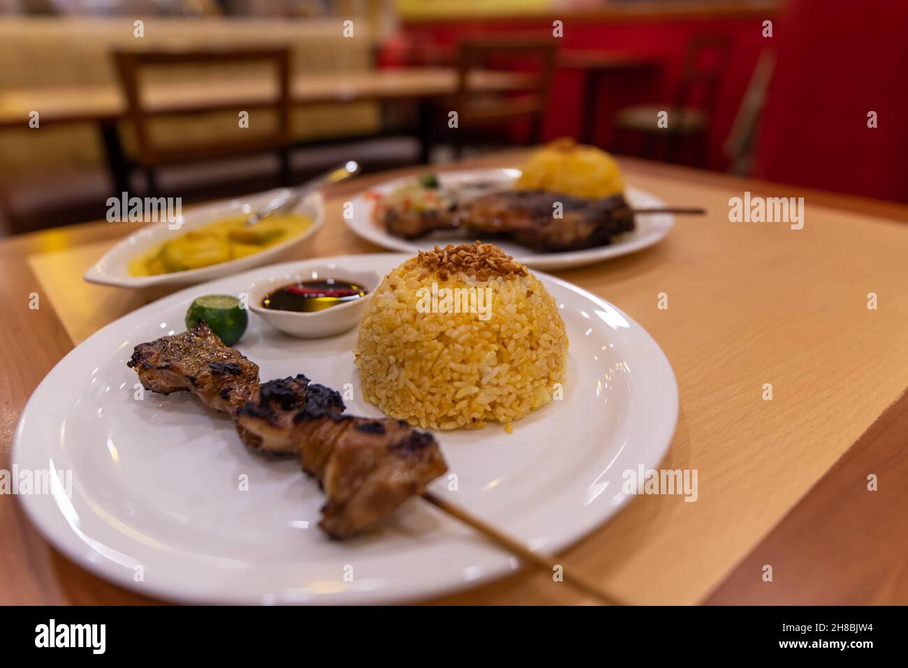 Popular Filipino food pork inasal with Java rice at Restaurant Stock ...