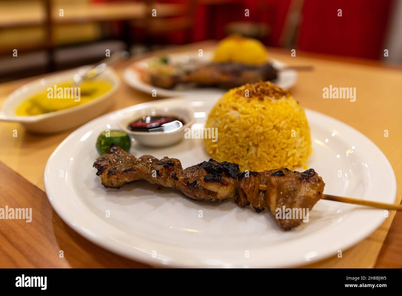 Popular Filipino food pork inasal with Java rice at Restaurant Stock ...