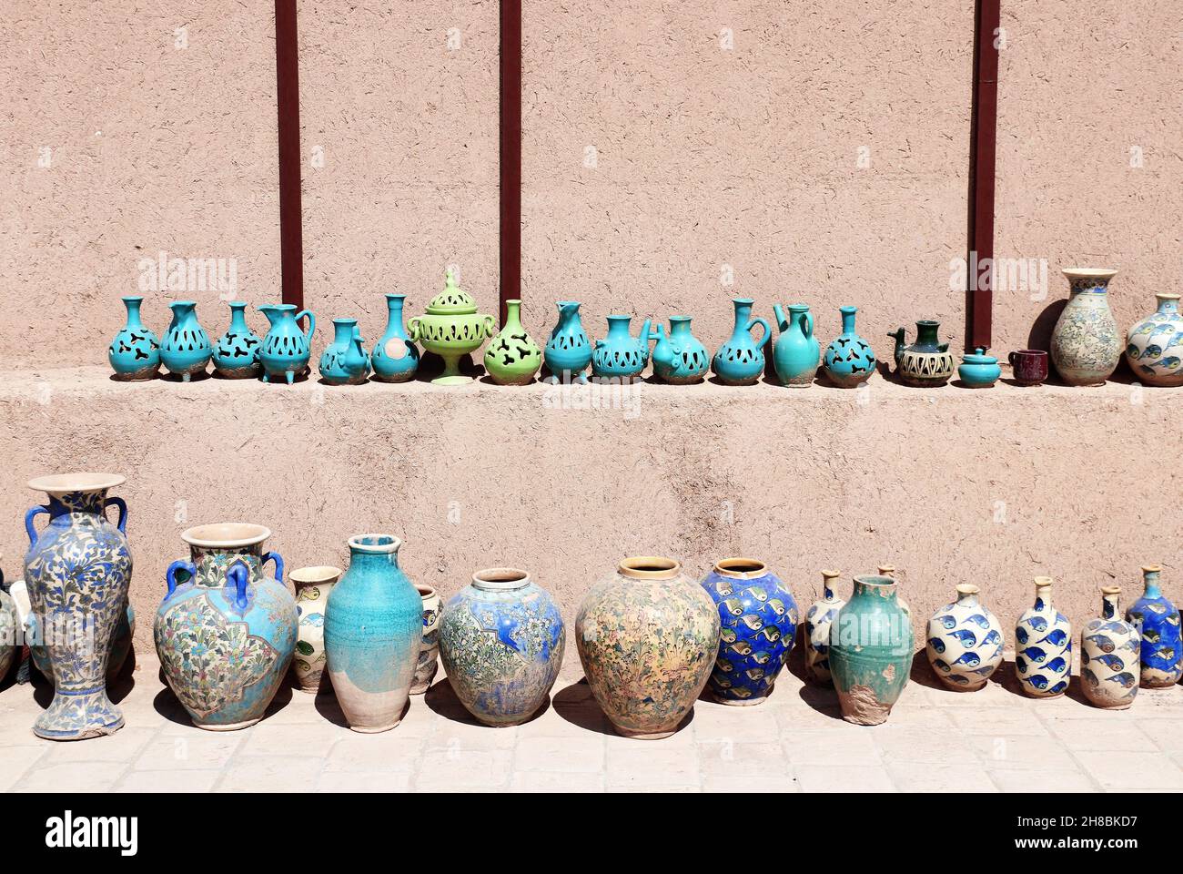 Traditional iranian souvenirs - colorful clay pot and jug, Yazd, Iran ...