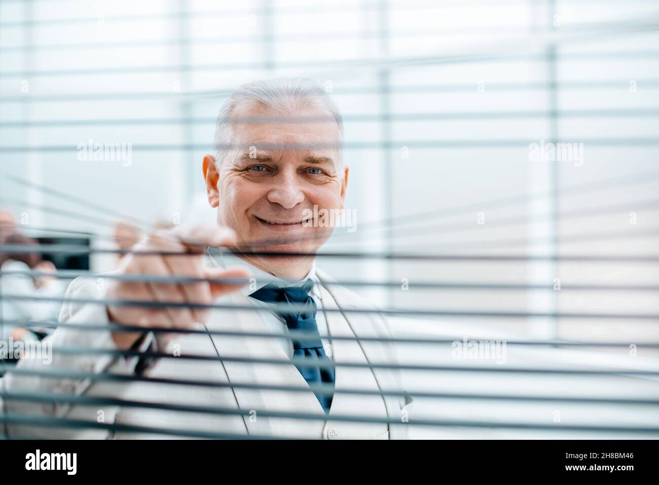 Boss watching through window hi-res stock photography and images - Alamy