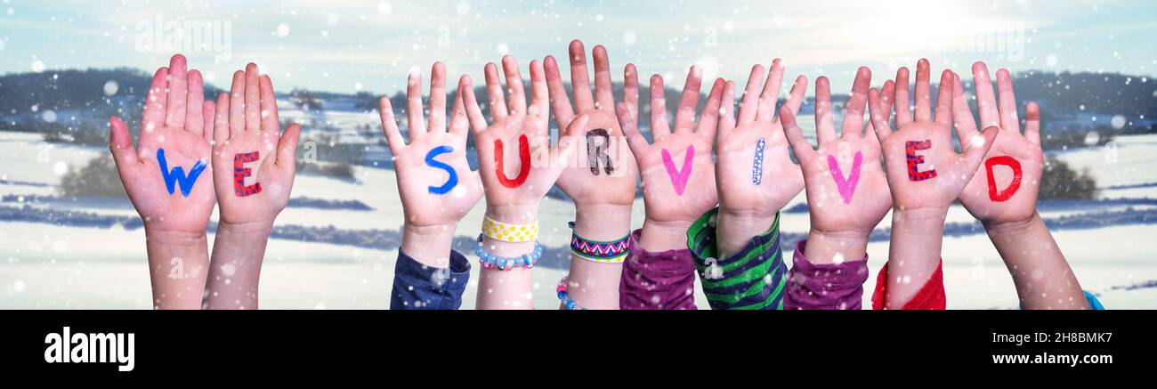 People Hands Holding Word We Survived, Snowy Winter Background Stock ...
