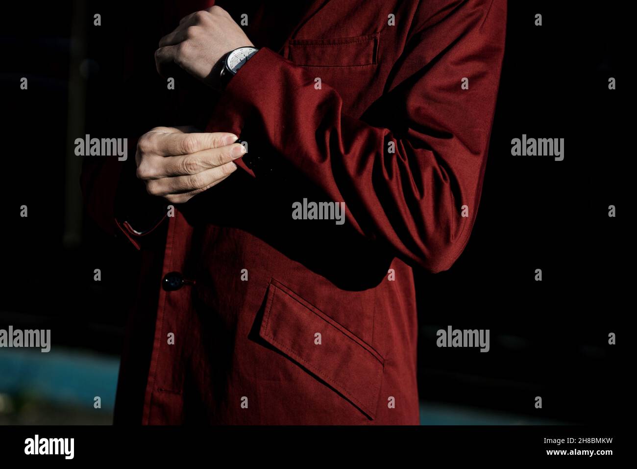 man in a suit with watch on wrist. style and buisness Stock Photo - Alamy