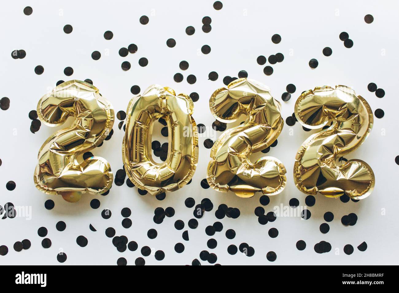 Balloons made of gold foil in the form of numbers 2022 with black ...