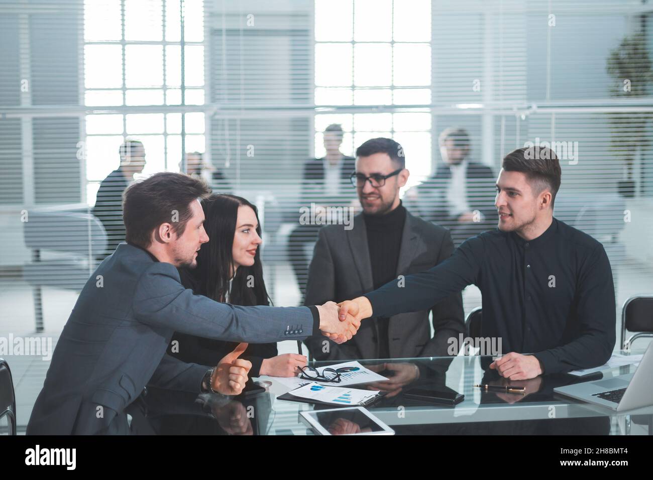 young employee explaining his ideas to colleagues Stock Photo - Alamy