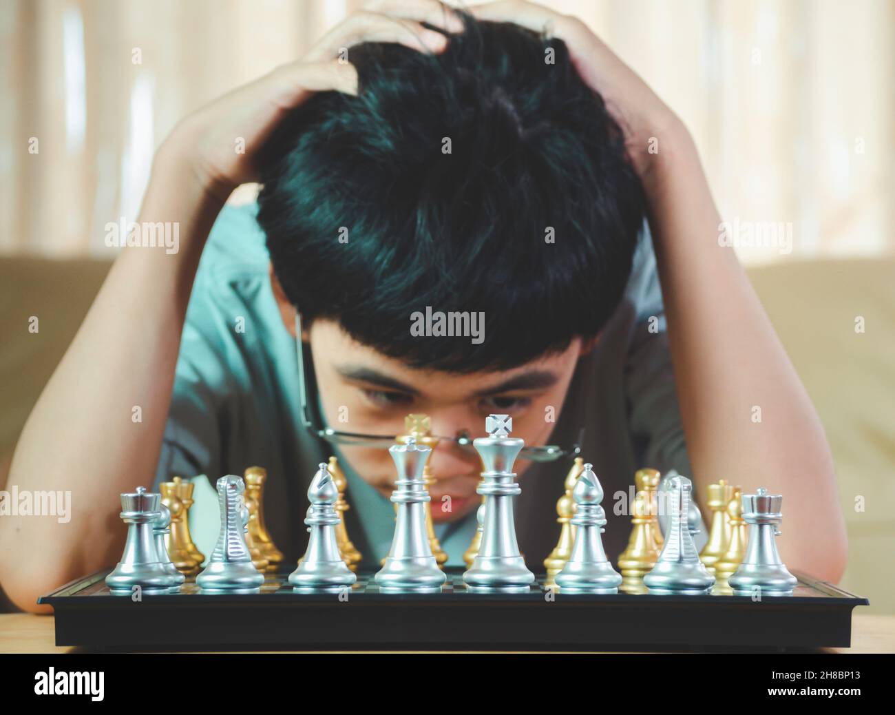 Concentrated serious boy developing chess gambit, strategy ,playing ...