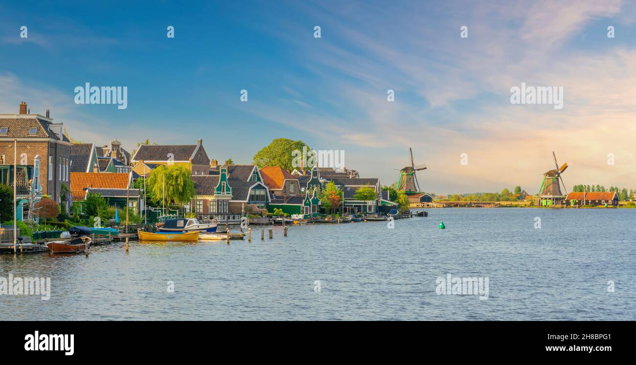 Traditional old village with dutch windmills in Amsterdam, Netherlands ...