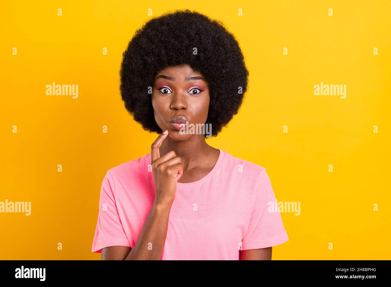 Photo of young black girl finger touch chin pouted lips send air kiss ...