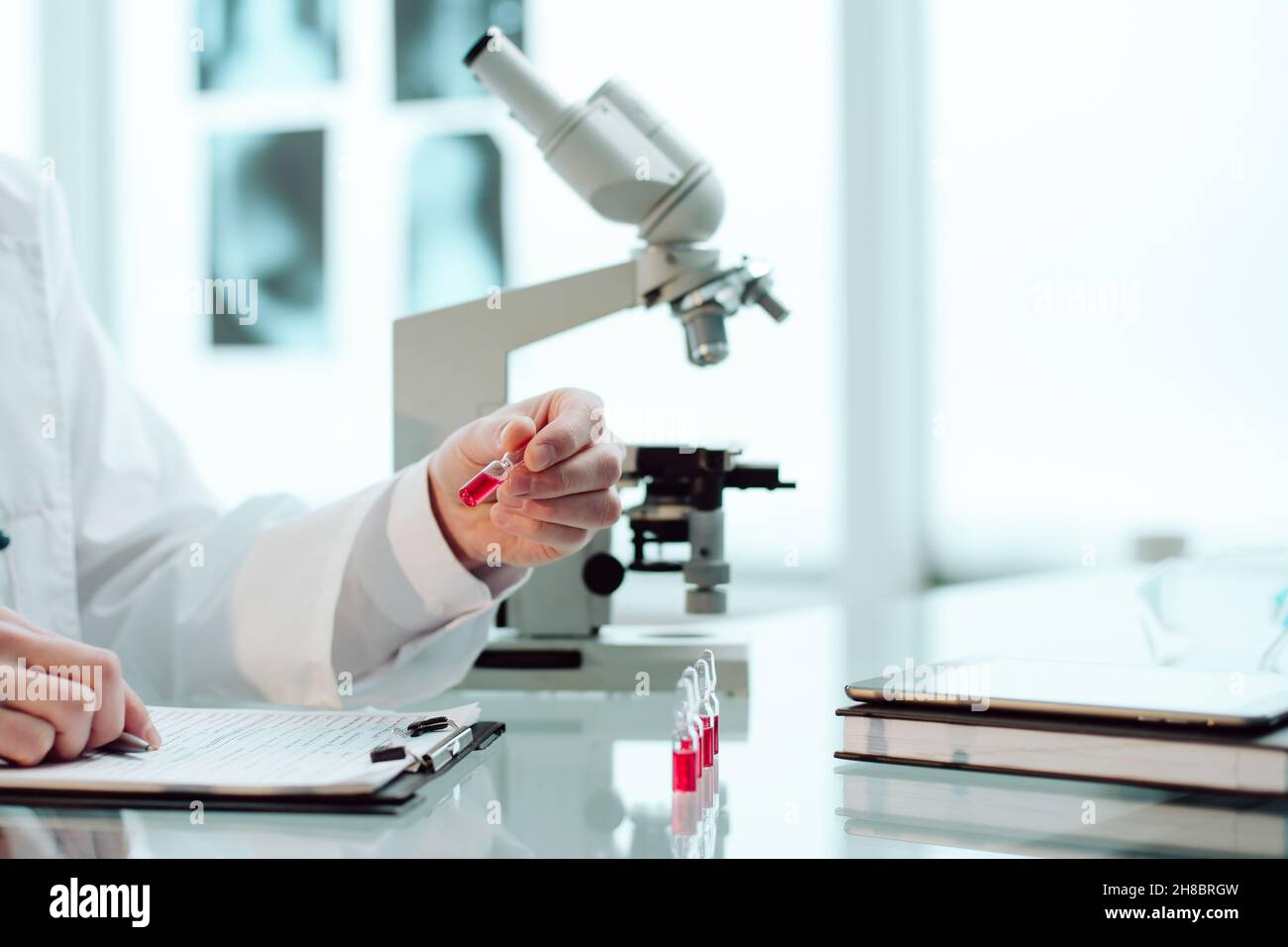 close-up. researcher writes the test results to the clipboard Stock ...