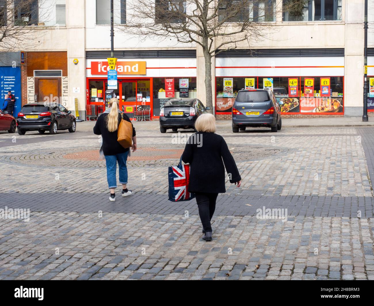 A shopper in Romford with a British flag shopping bag Stock Photo - Alamy