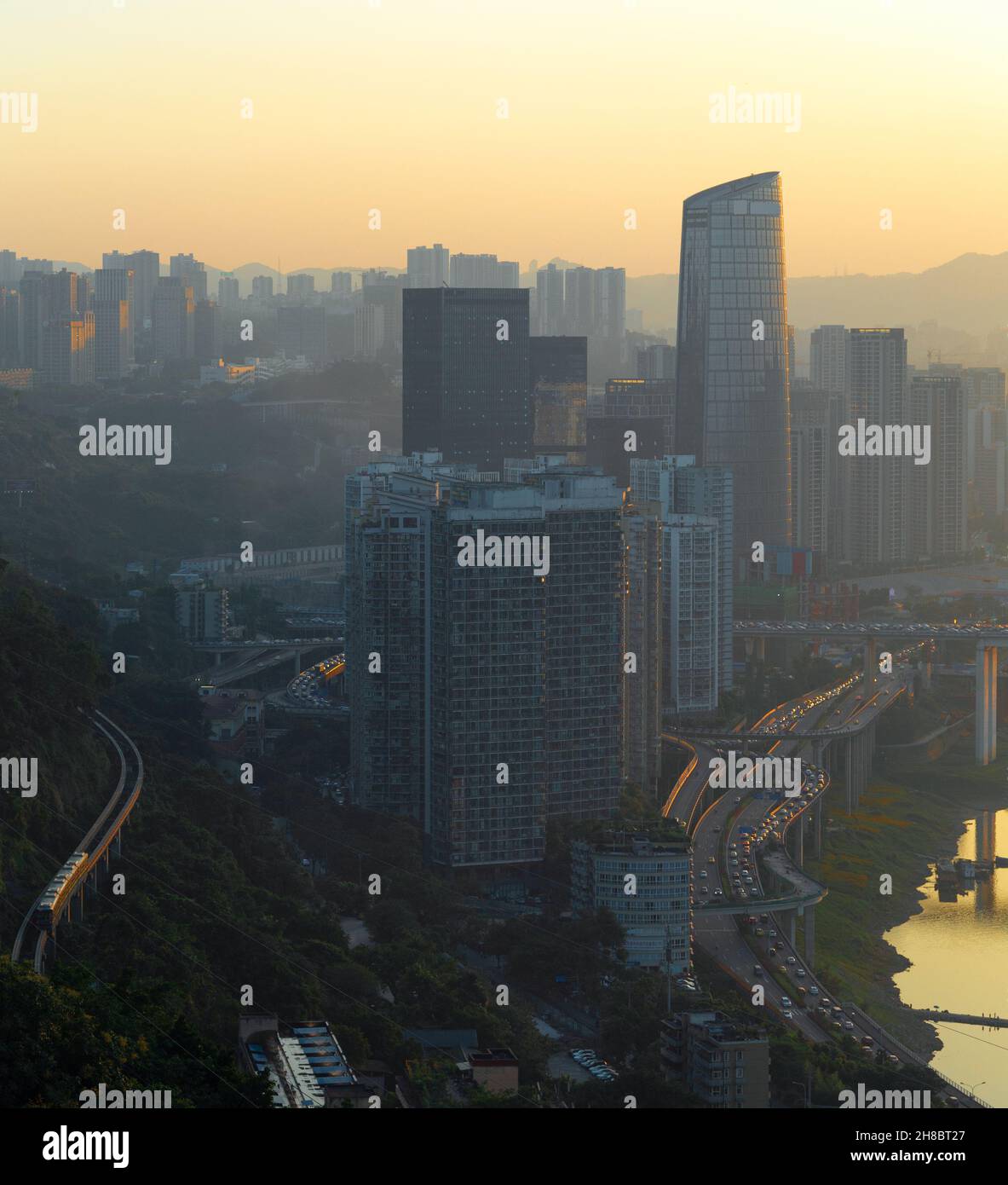 In the evening, the sun sets on the river bank city scenery. This is ...