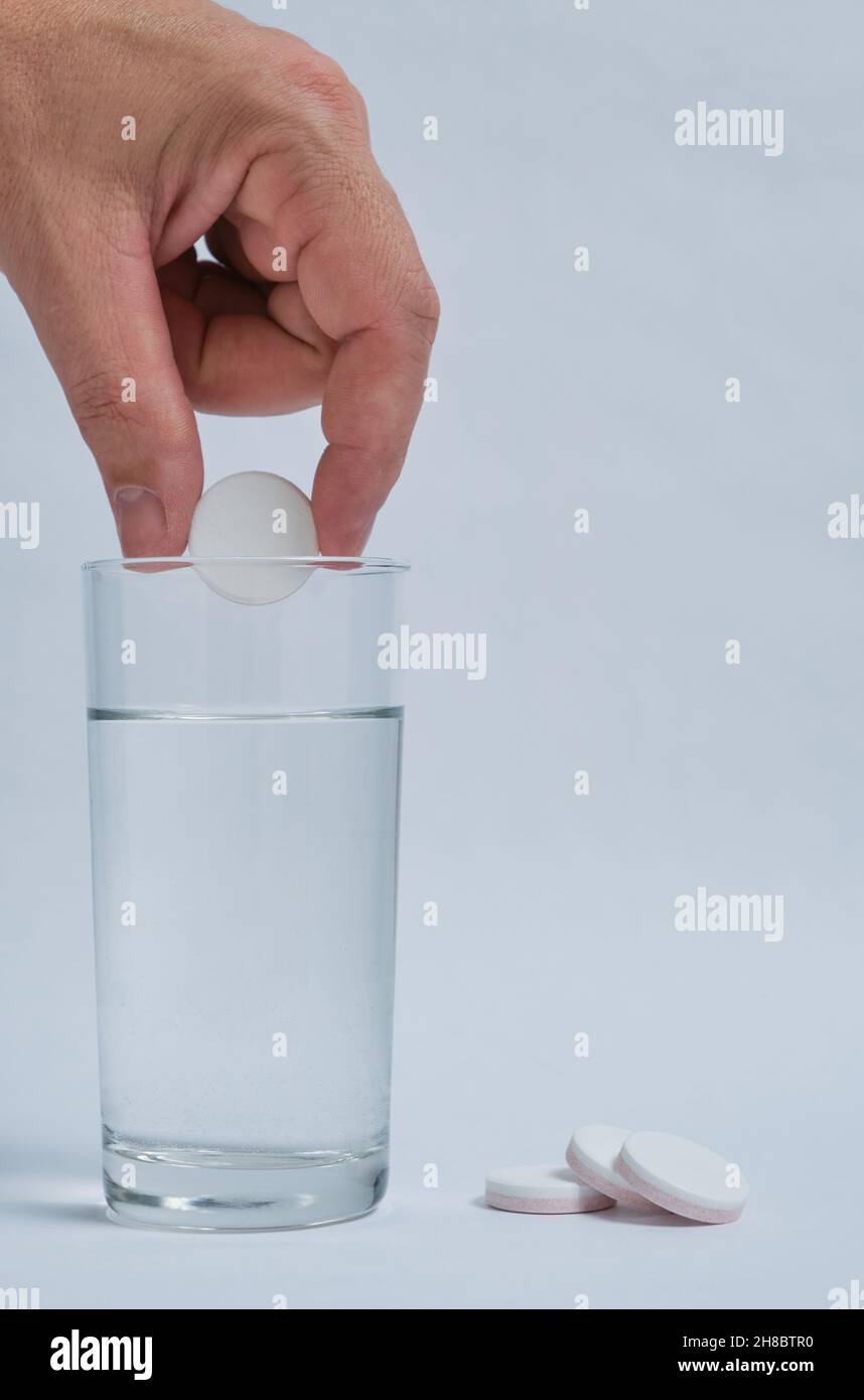 Hand throws tablet water glass hi-res stock photography and images - Alamy