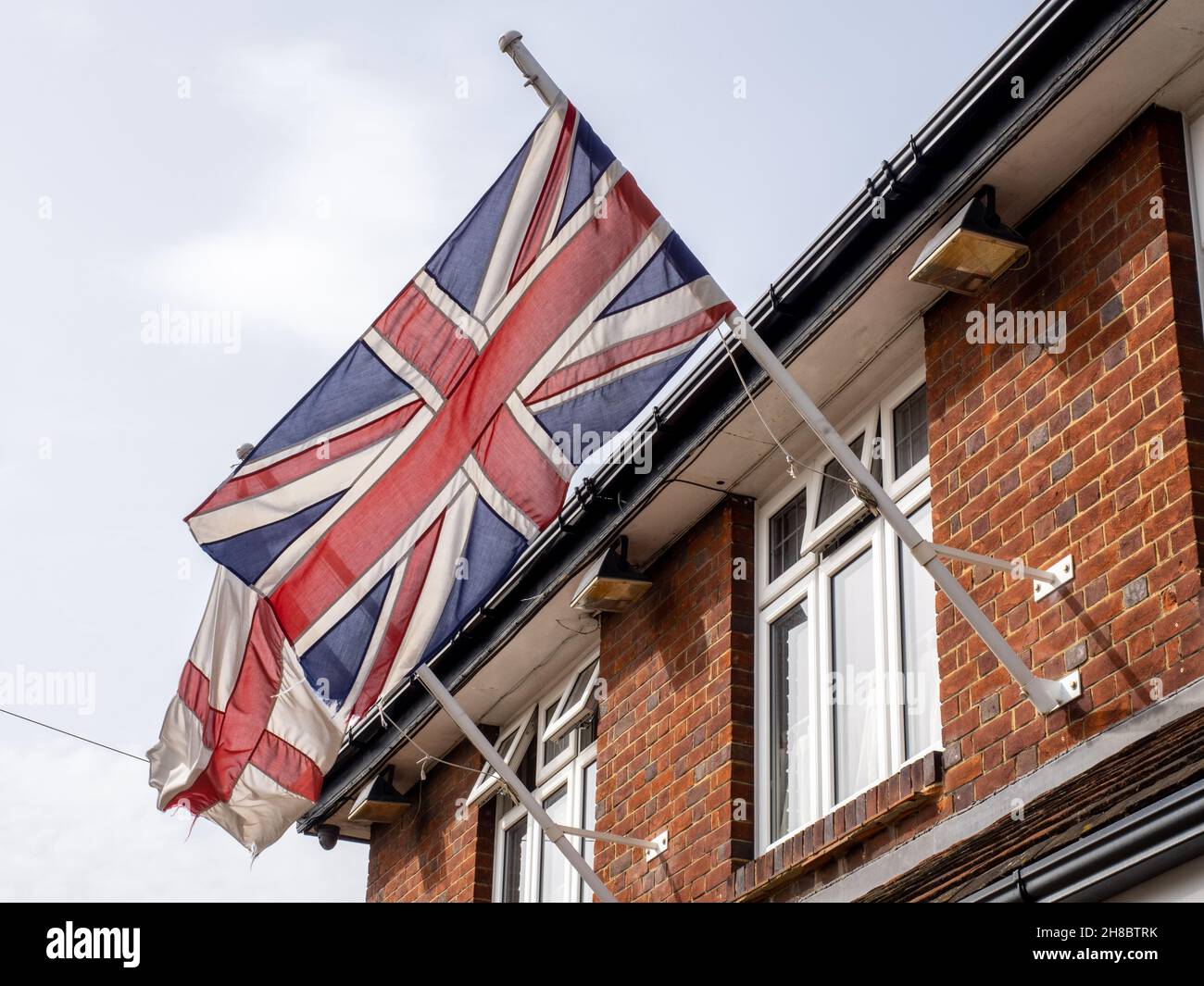 A British flag flies outside a pub in Romford, Essex Stock Photo - Alamy