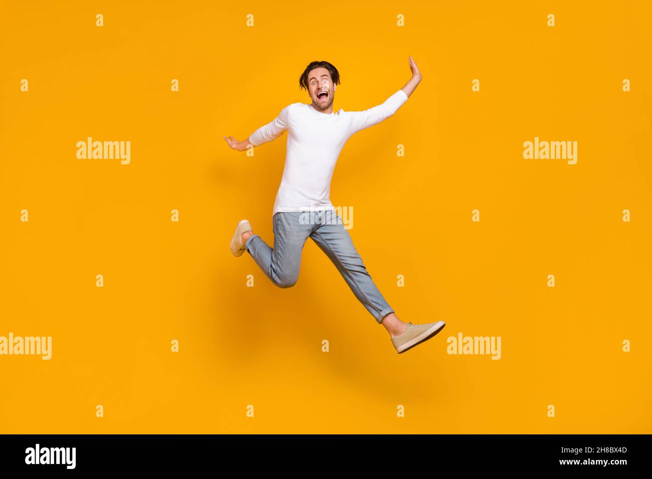 Full body photo of scared brunet young guy run wear shirt jeans ...